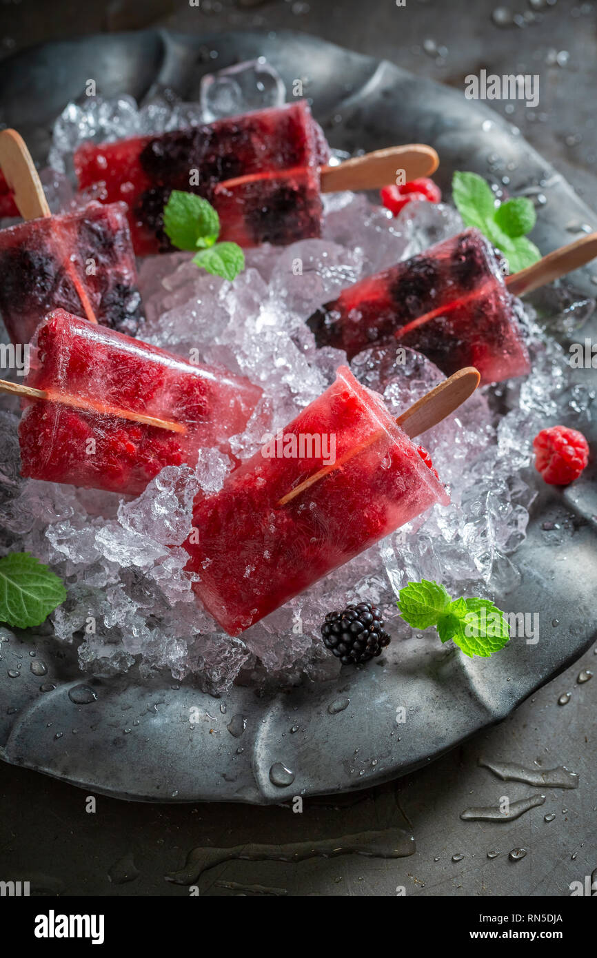 Tasty berry fruits ice cream on a stick Stock Photo - Alamy
