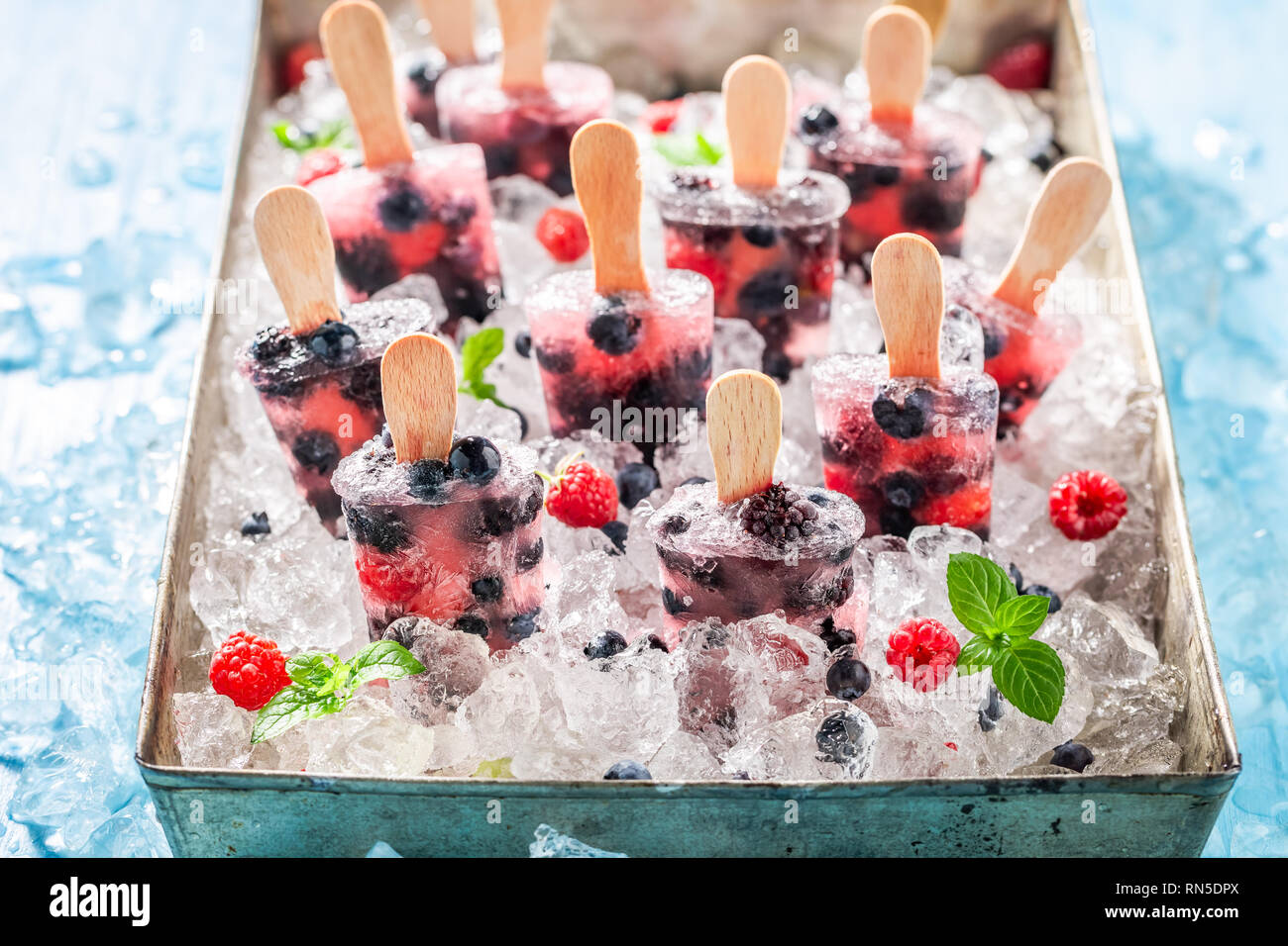 Juicy berry fruits ice cream on a stick Stock Photo - Alamy