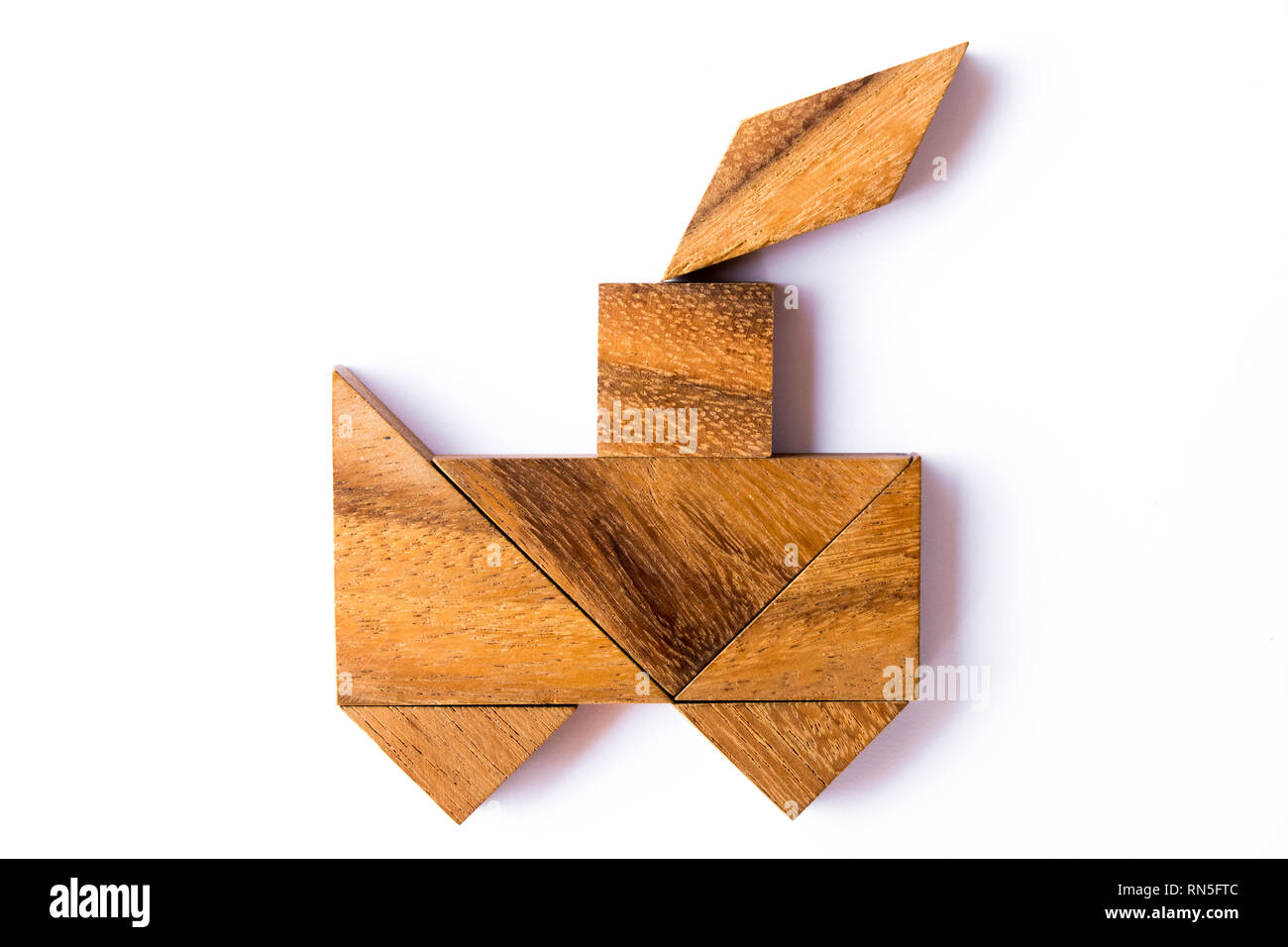 Wood tangram puzzle in train shape on white background Stock Photo - Alamy
