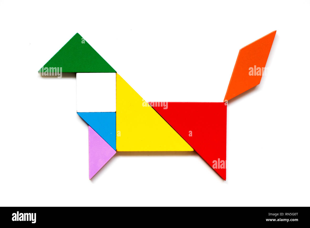 Color wood tangram puzzle in dog shape on white background Stock Photo ...