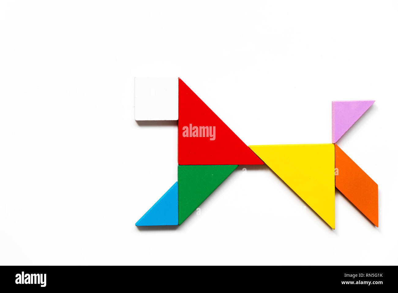 Color wood tangram puzzle in dog shape on white background Stock Photo ...