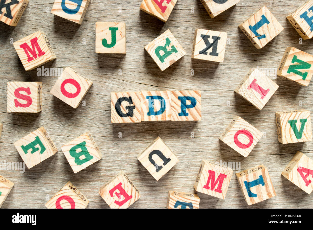 Letter block in word GDP with another on wood background Stock Photo ...