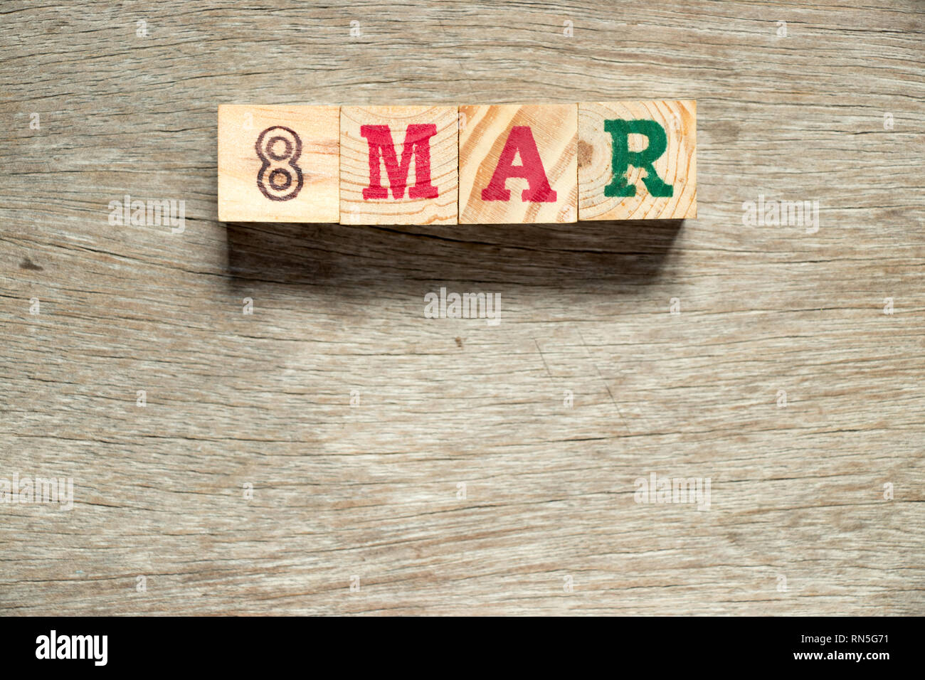 Letter block in word 8 mar on wood background (This day is ...