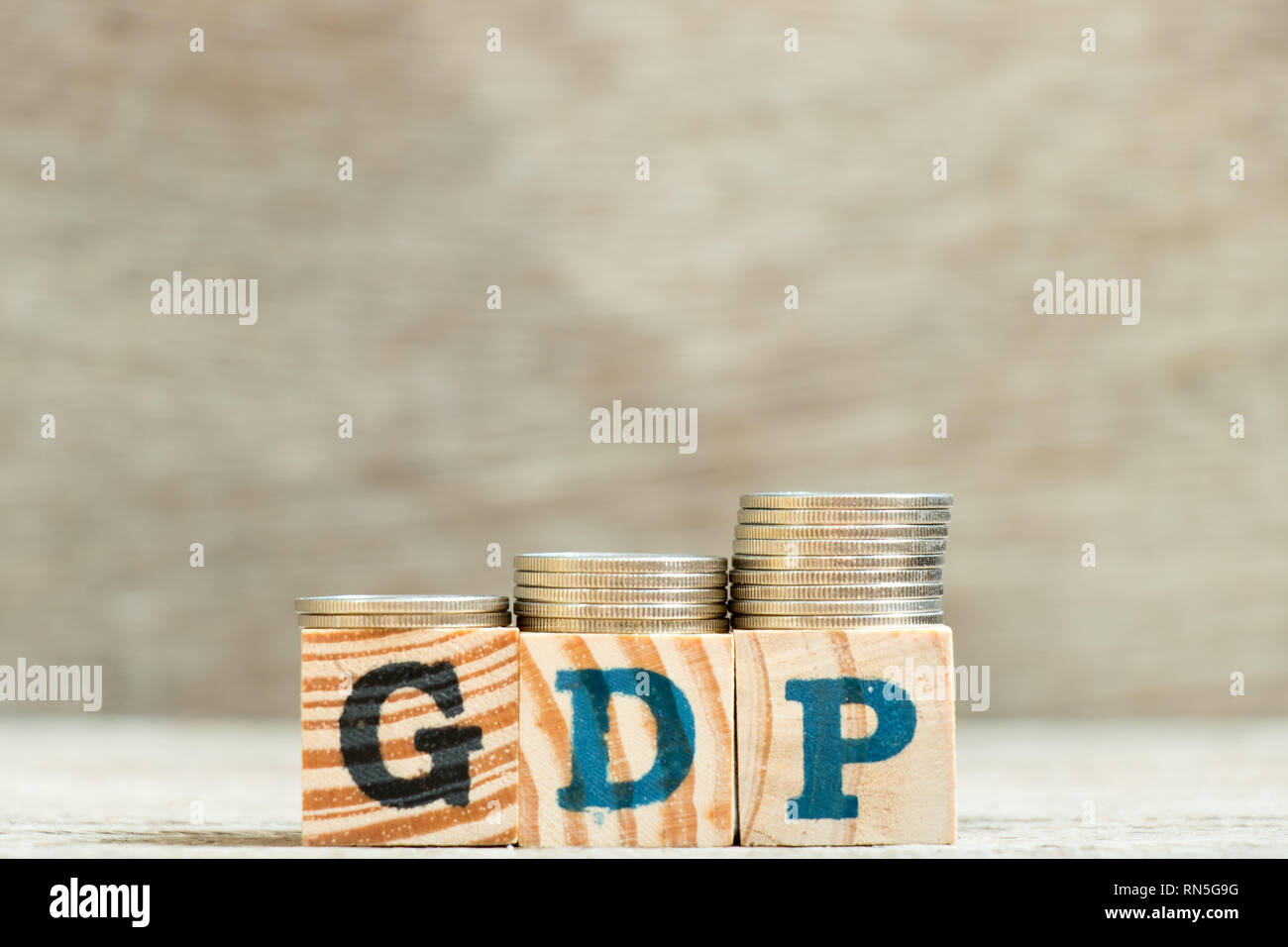 Block in word GDP (Gross domestic product) with coin in increase trend ...