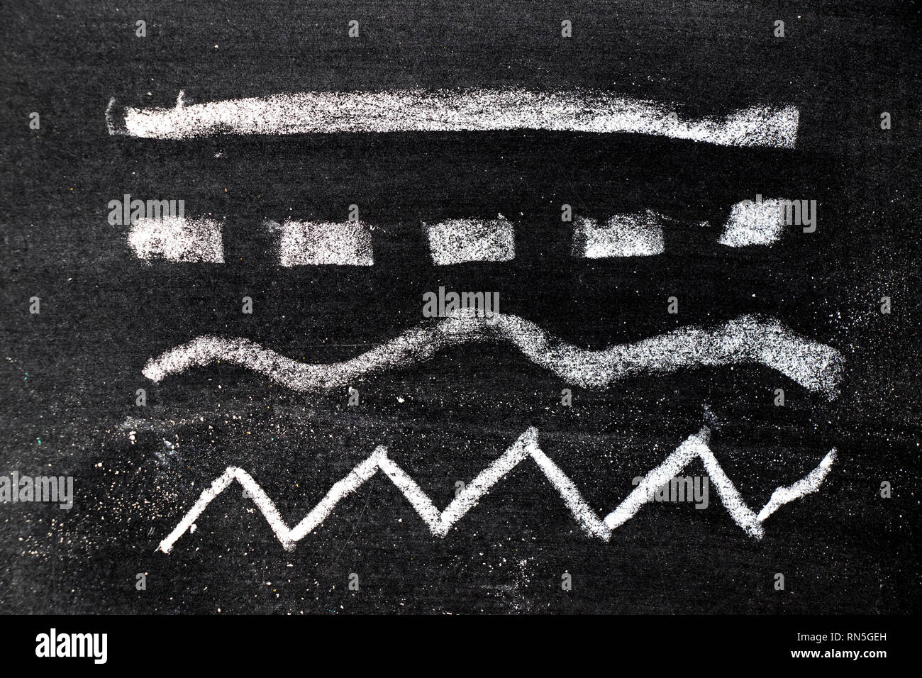 White chalk hand drawing in set of line shape on blackboard background ...
