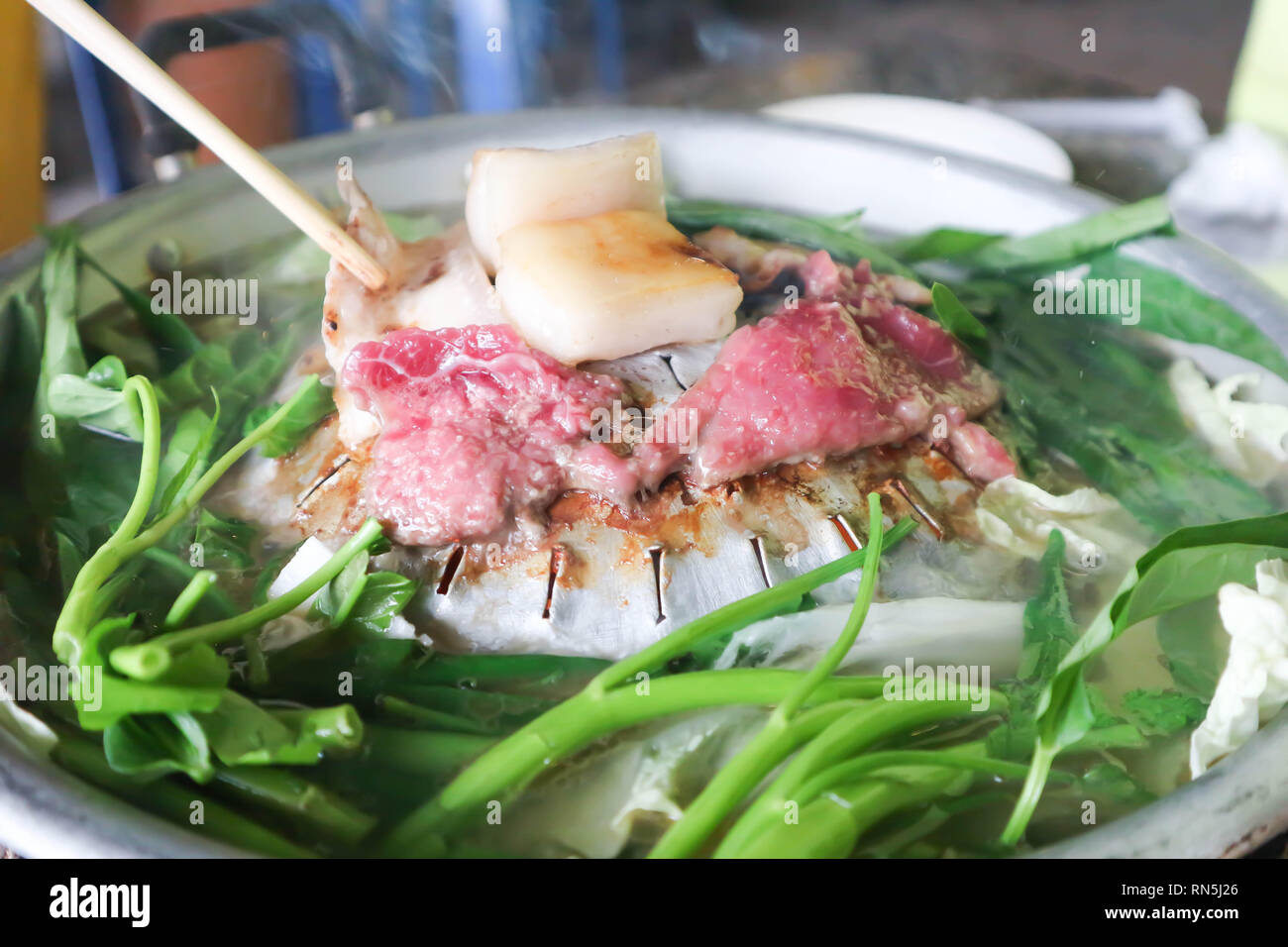raw beef and raw pork in the toaster Stock Photo - Alamy
