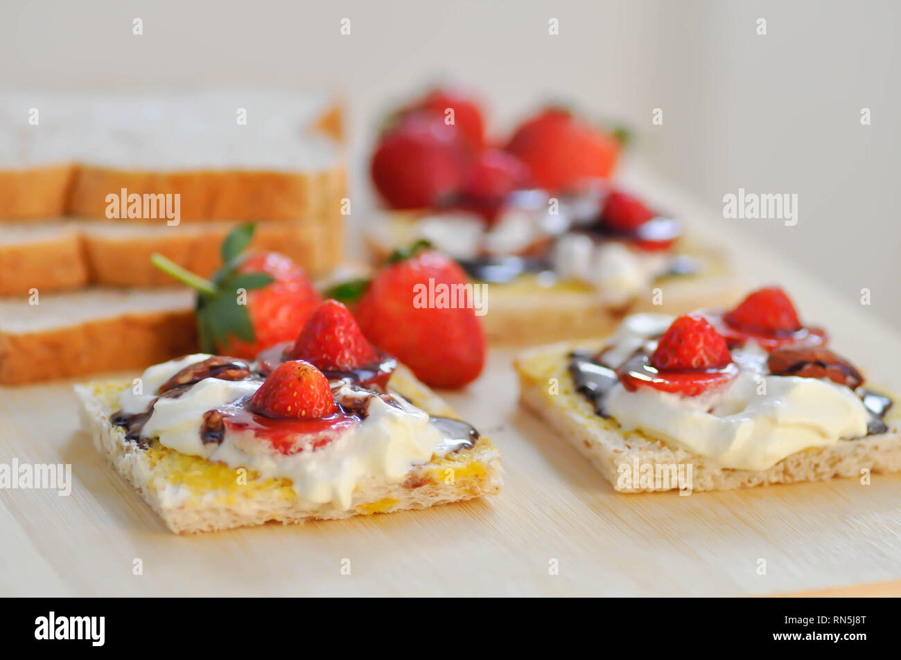 whole wheat bread and canape with strawberry topping Stock Photo - Alamy