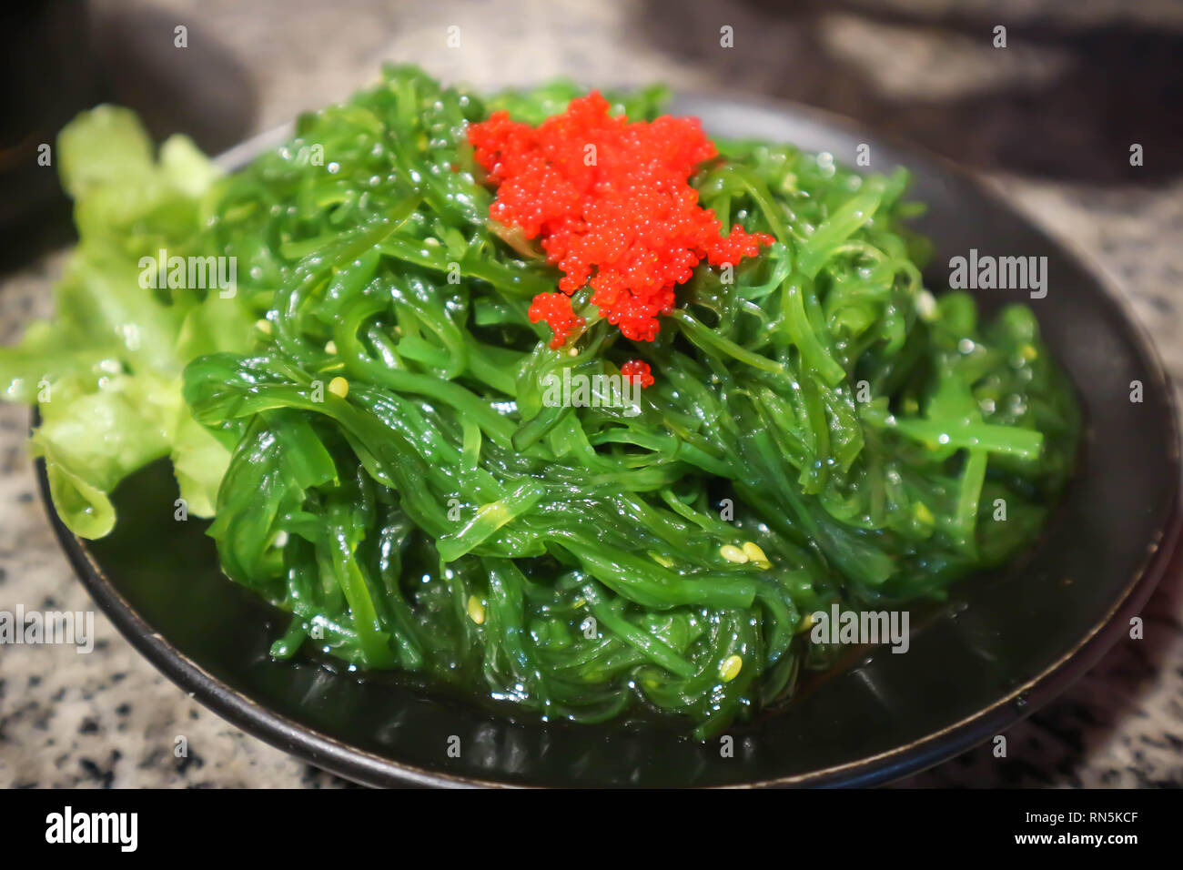 seaweed salad with shrimp egg topping Stock Photo - Alamy
