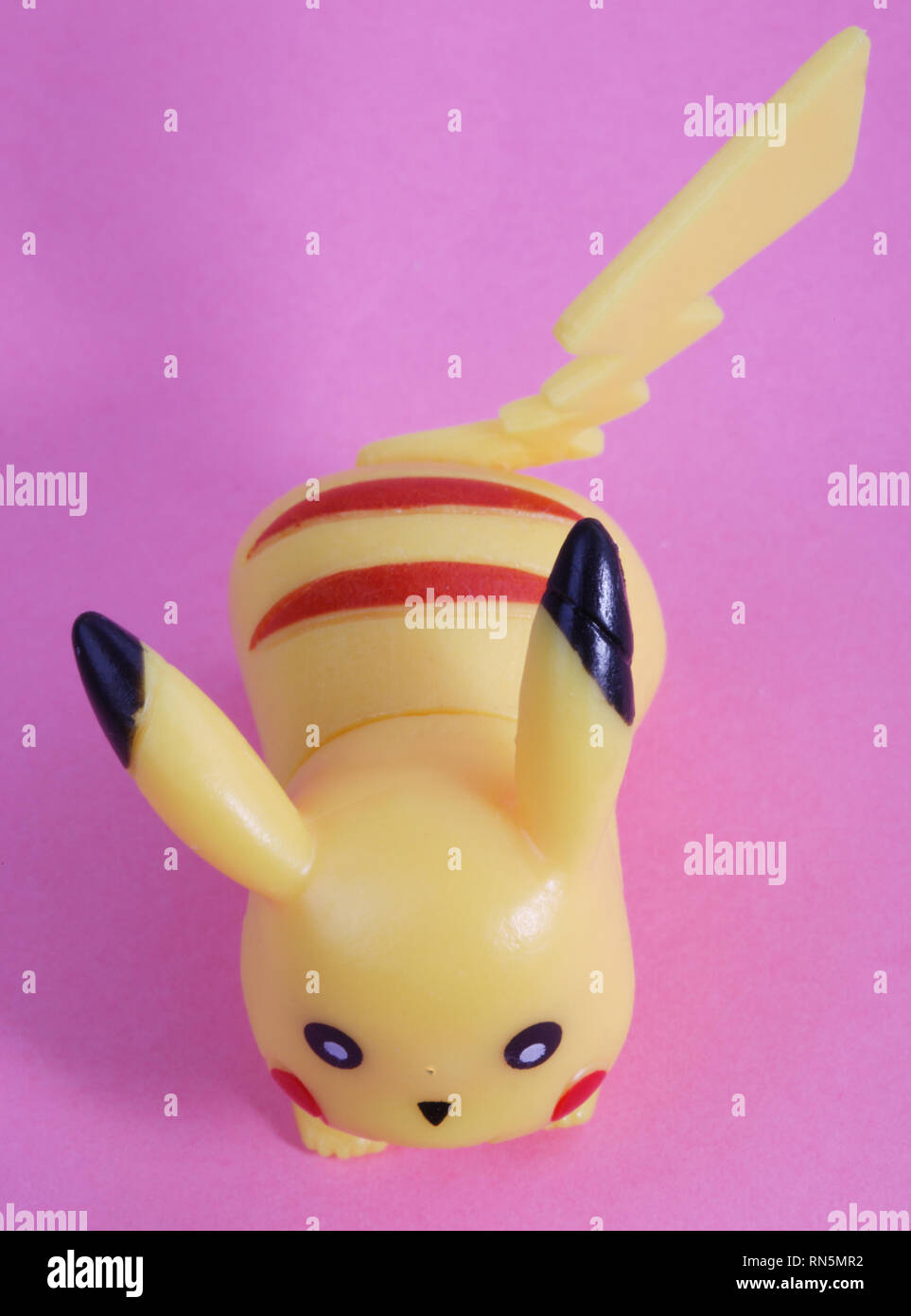 plastic toy on pink background Stock Photo - Alamy