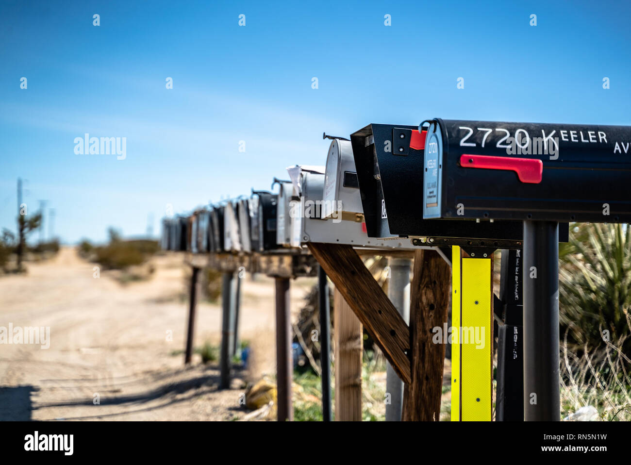 A set of mailboxes in a row in the desert in the US Stock Photo - Alamy