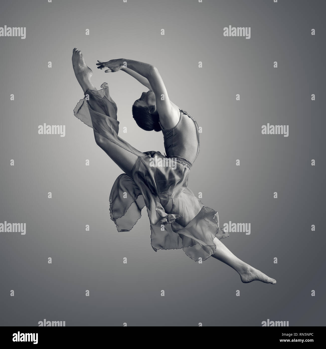Ballerina jumping in air Stock Photo - Alamy