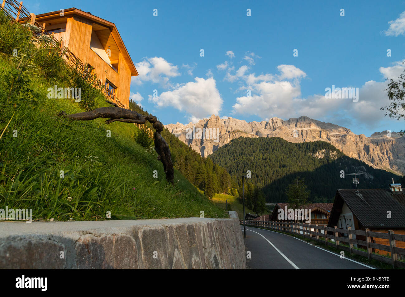 The Enrosadira phenomenon at sunset on the Dolomites of the Sella group ...