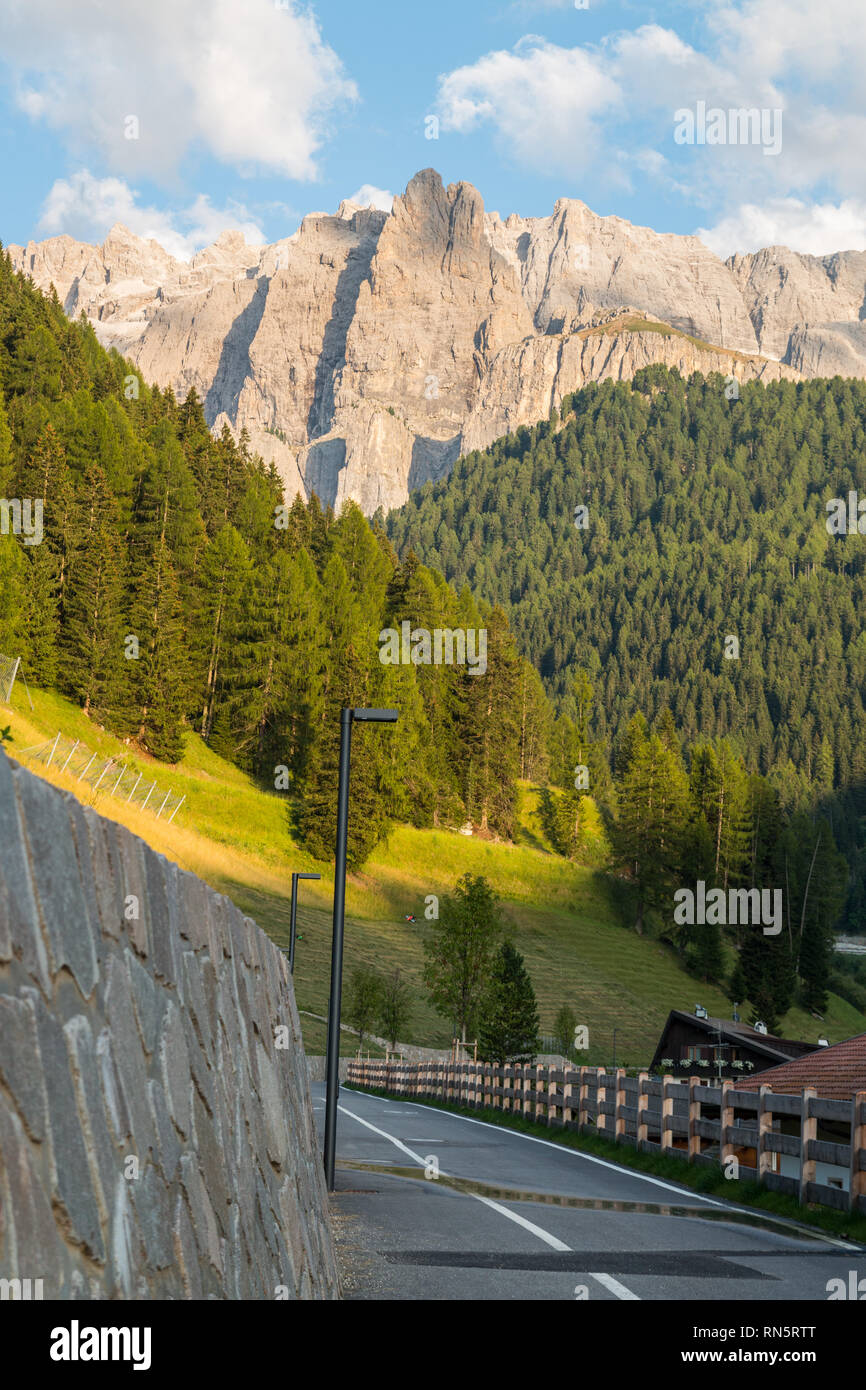 The Enrosadira phenomenon at sunset on the Dolomites of the Sella group ...
