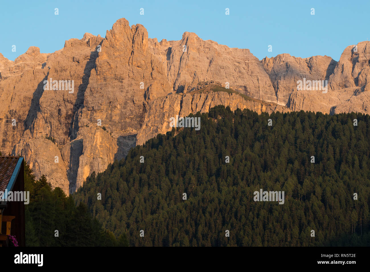 The Enrosadira phenomenon at sunset on the Dolomites of the Sella group ...