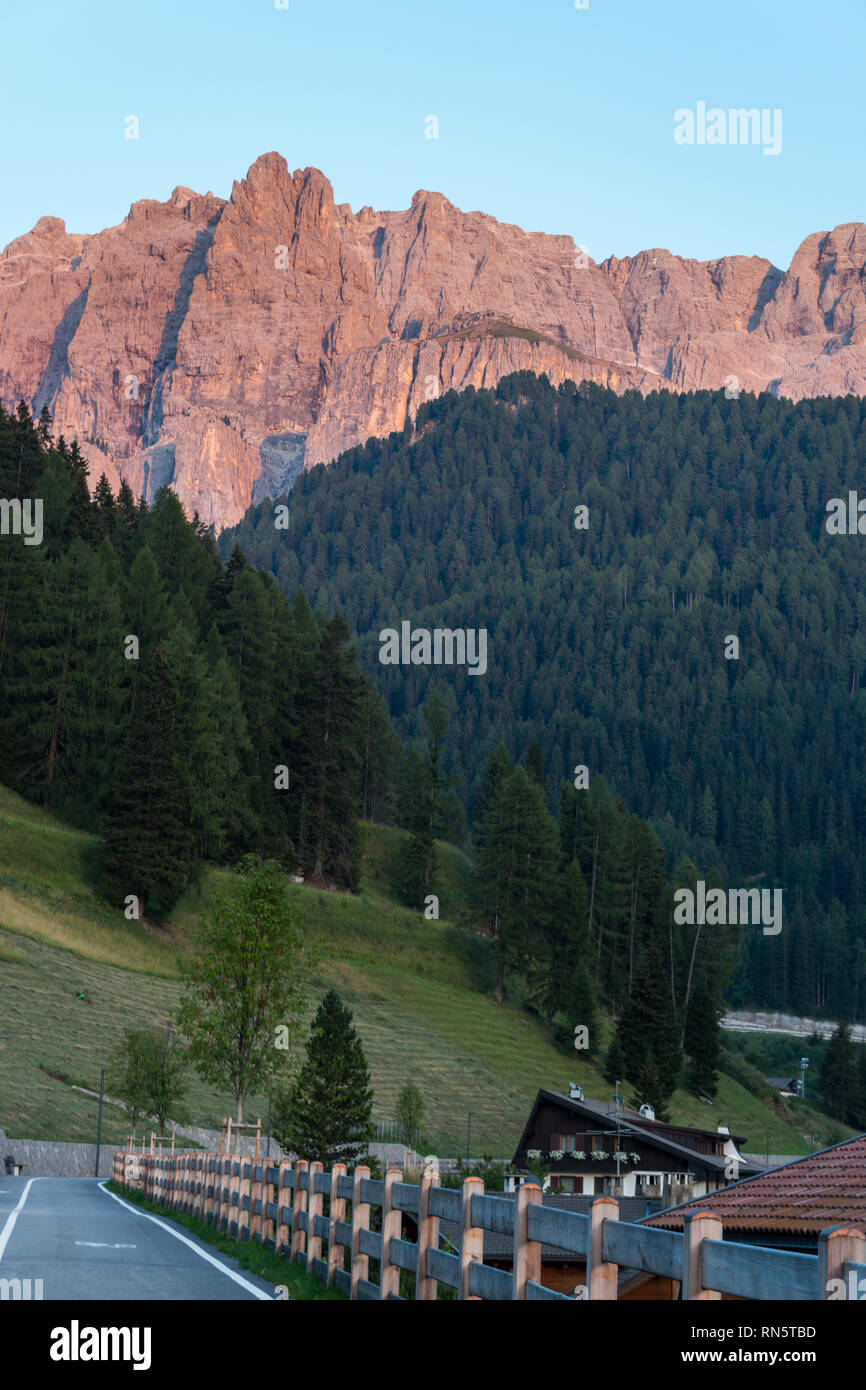 The Enrosadira phenomenon at sunset on the Dolomites of the Sella group ...