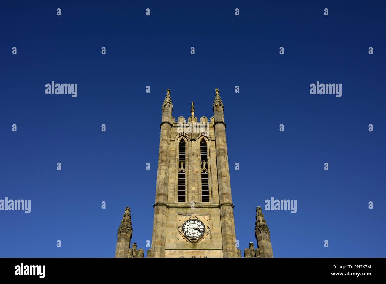 All saints church stand clock tower with blue sky in whitefield greater ...
