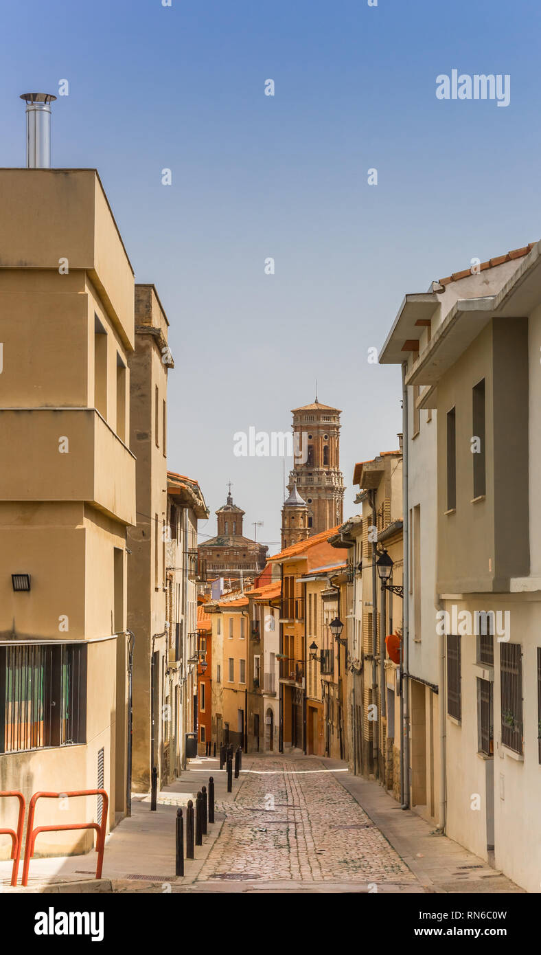 Street with colorful houses and cathedral tower in Tudela, Spain Stock ...
