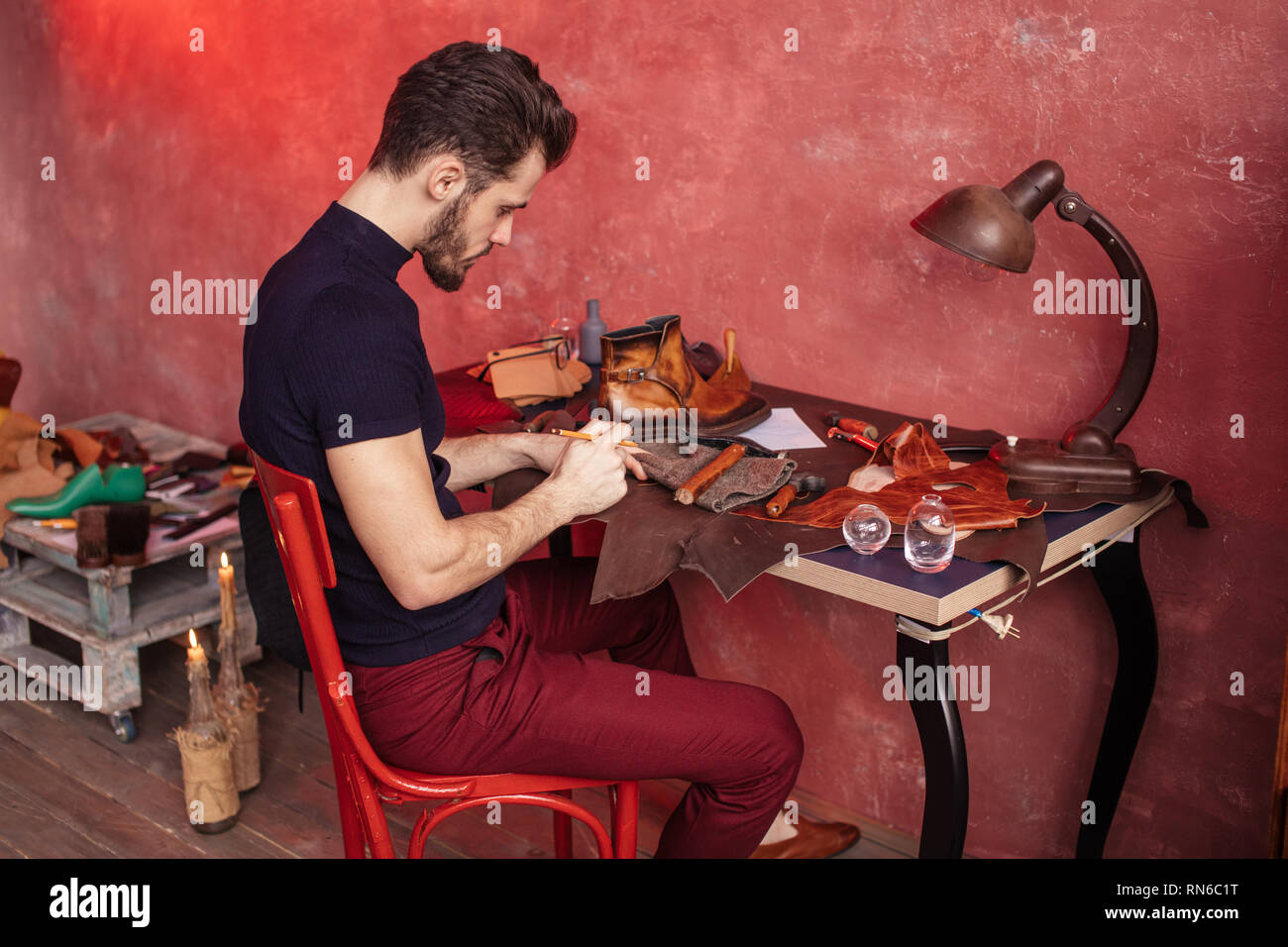 Young man repairing shoes hi-res stock photography and images - Alamy