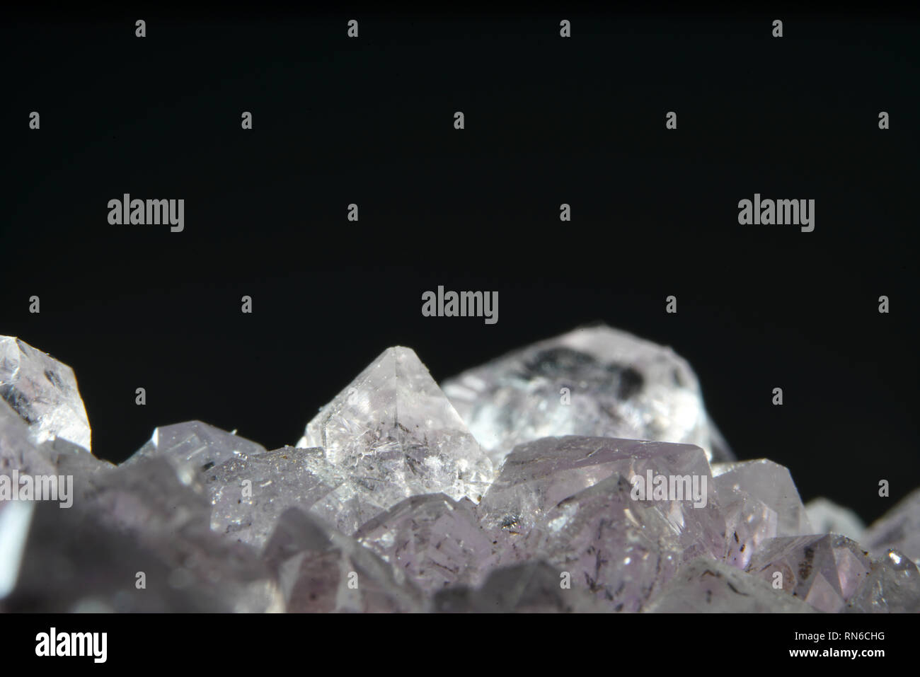 Quartz also called deep quartz photographed in studio in front of black ...