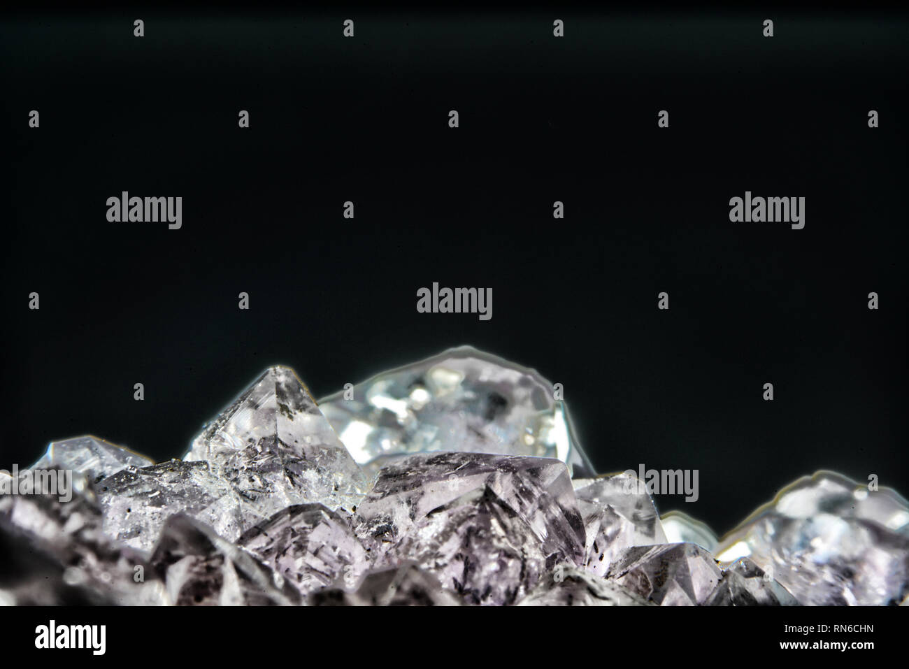 Quartz also called deep quartz photographed in studio in front of black ...