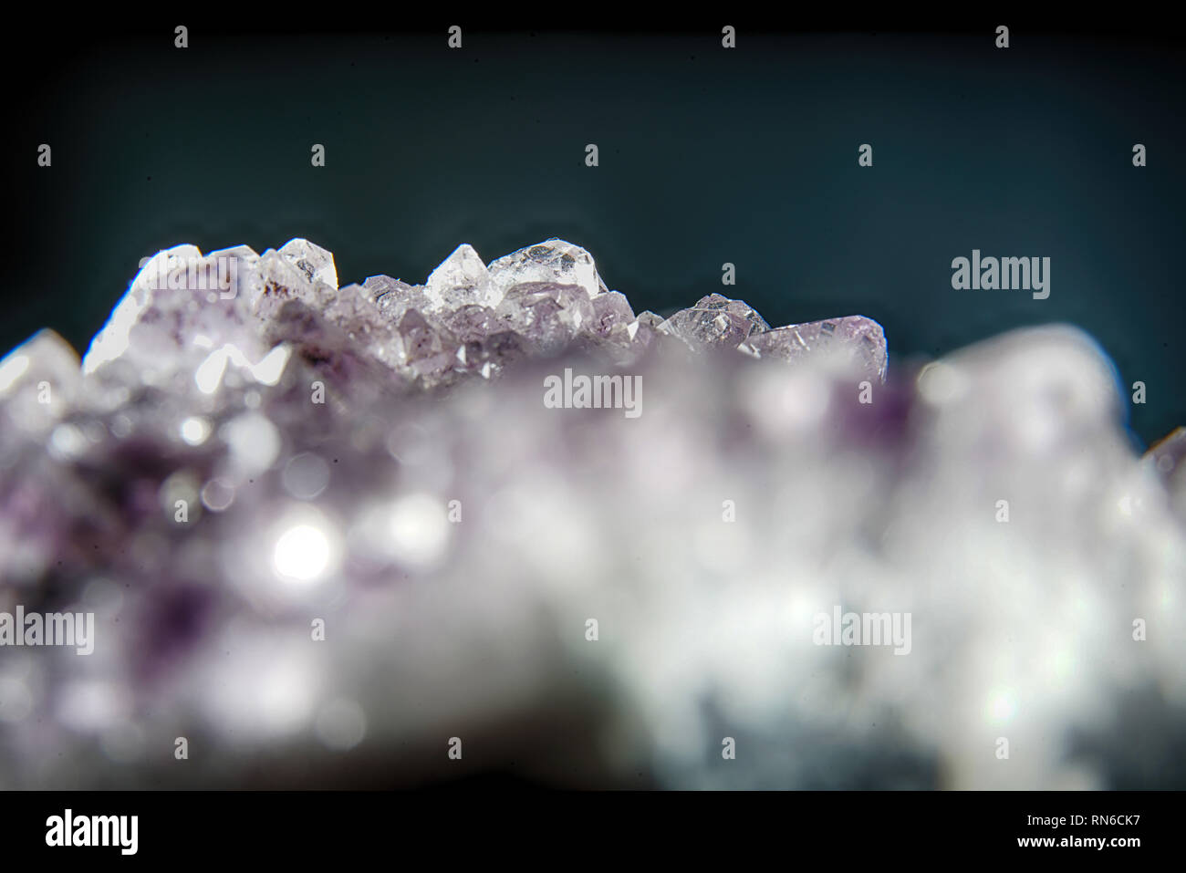 Quartz also called deep quartz photographed in studio in front of black ...