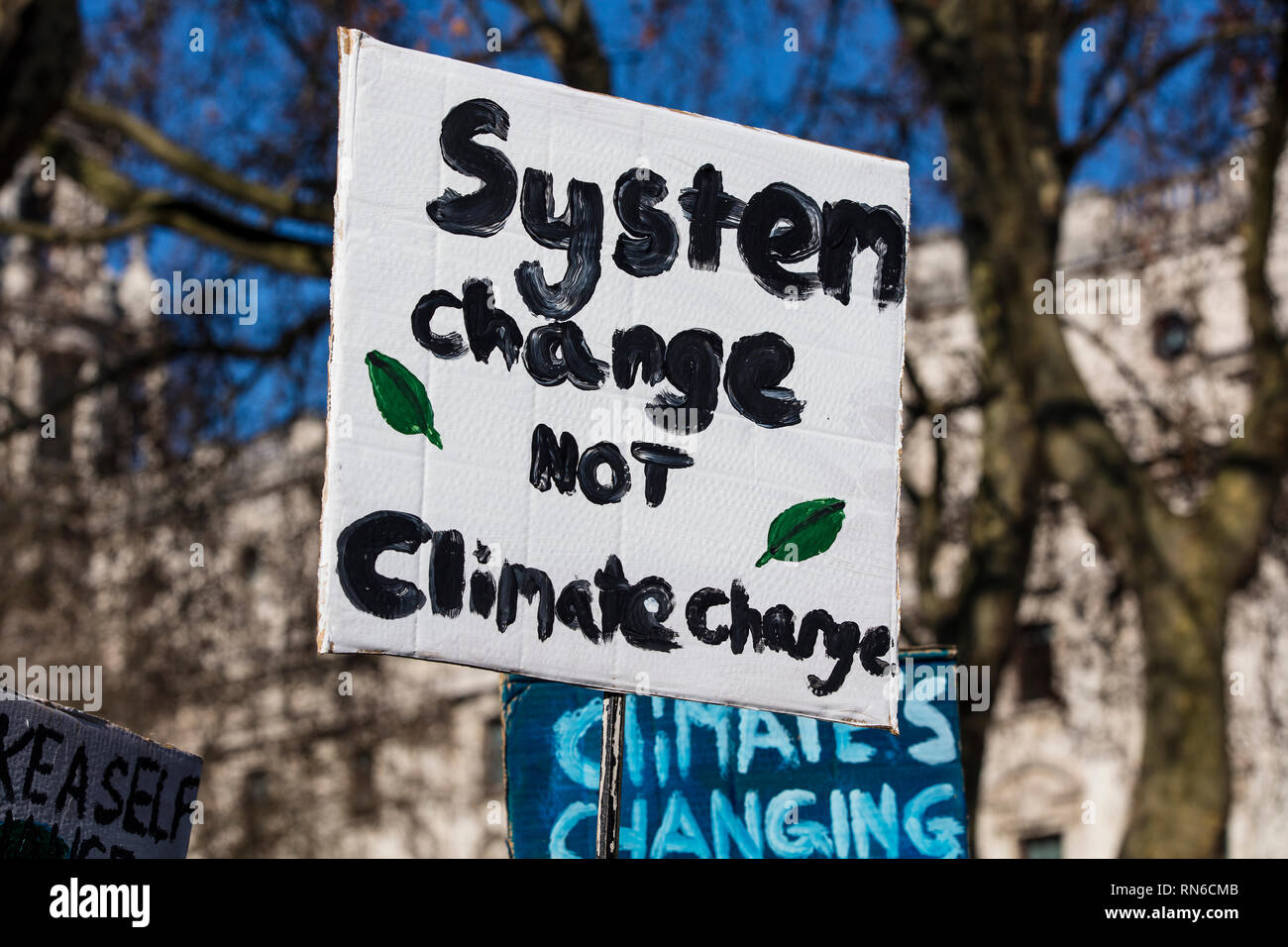 Protestors holding climate change banners at a protest Stock Photo - Alamy