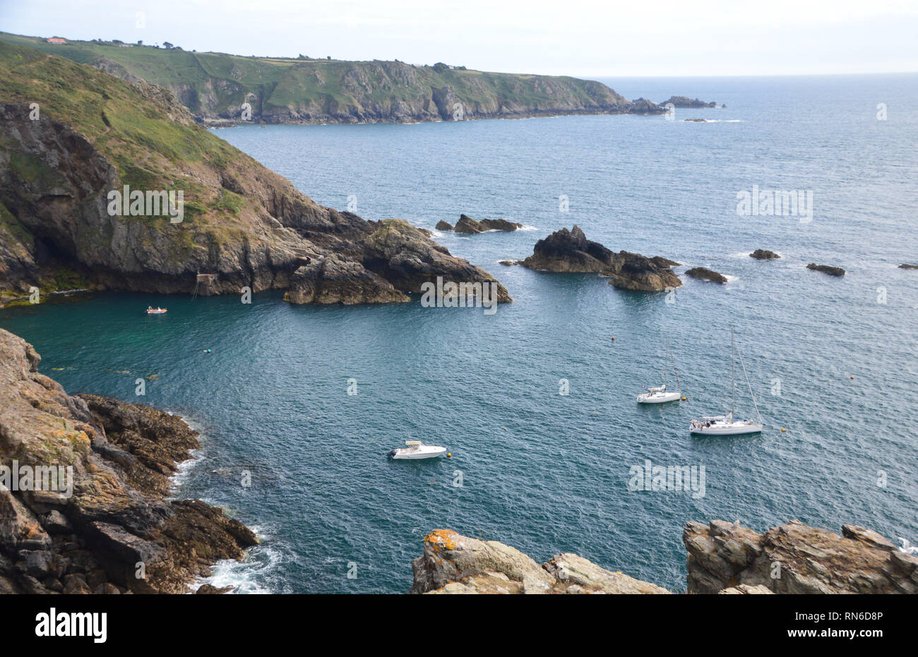 Three Small Boats Moored in La Havre Gosselin Harbour Between the ...