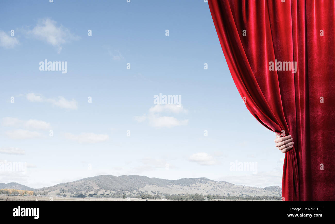 Human hand behind curtain hi-res stock photography and images - Alamy