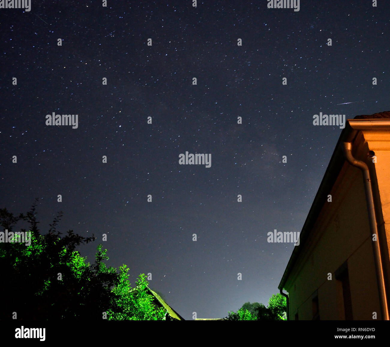 Night sky with stars above the village Stock Photo - Alamy