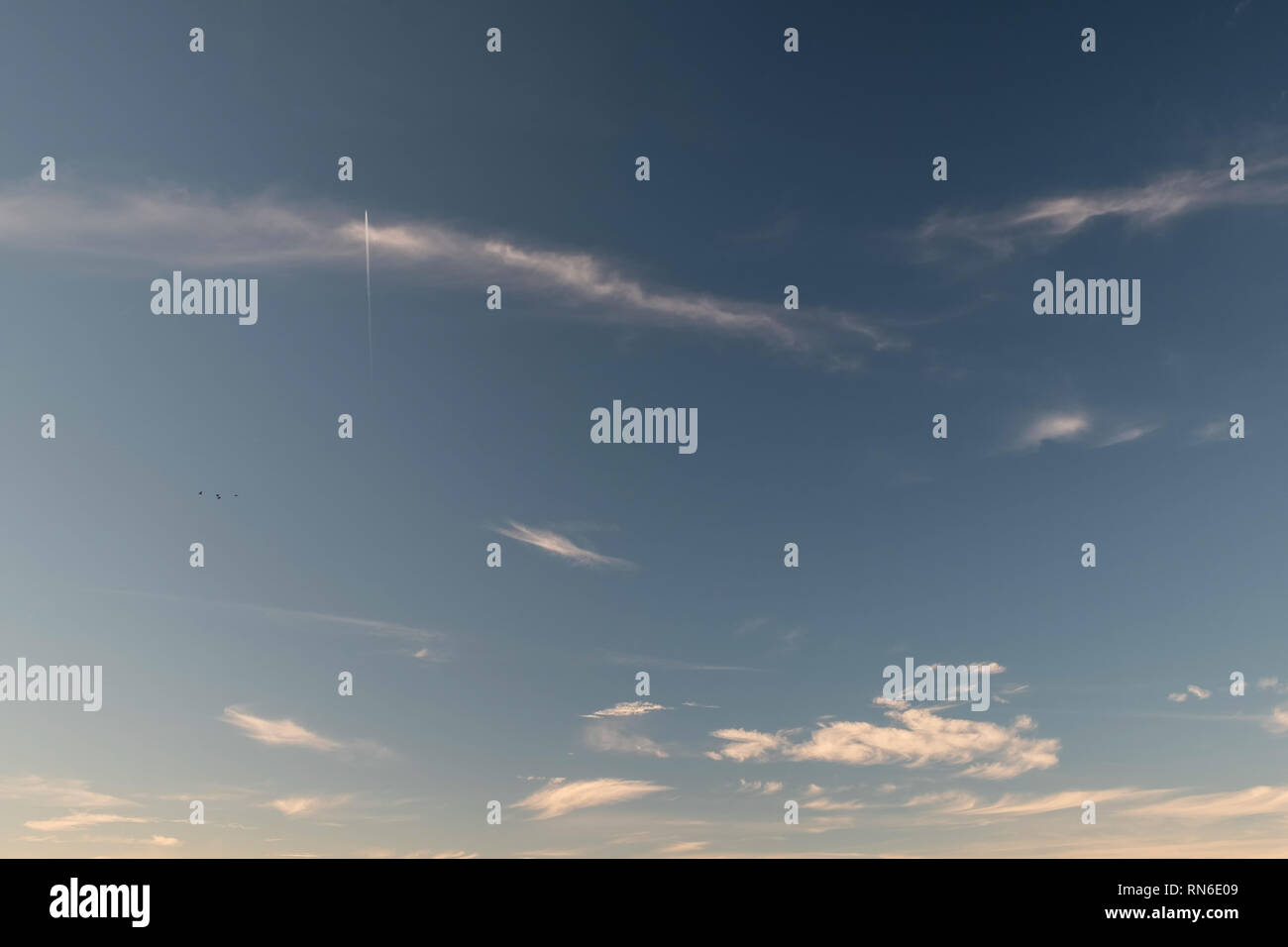 texture background wallpaper blue sky with clouds, an airplane und ...