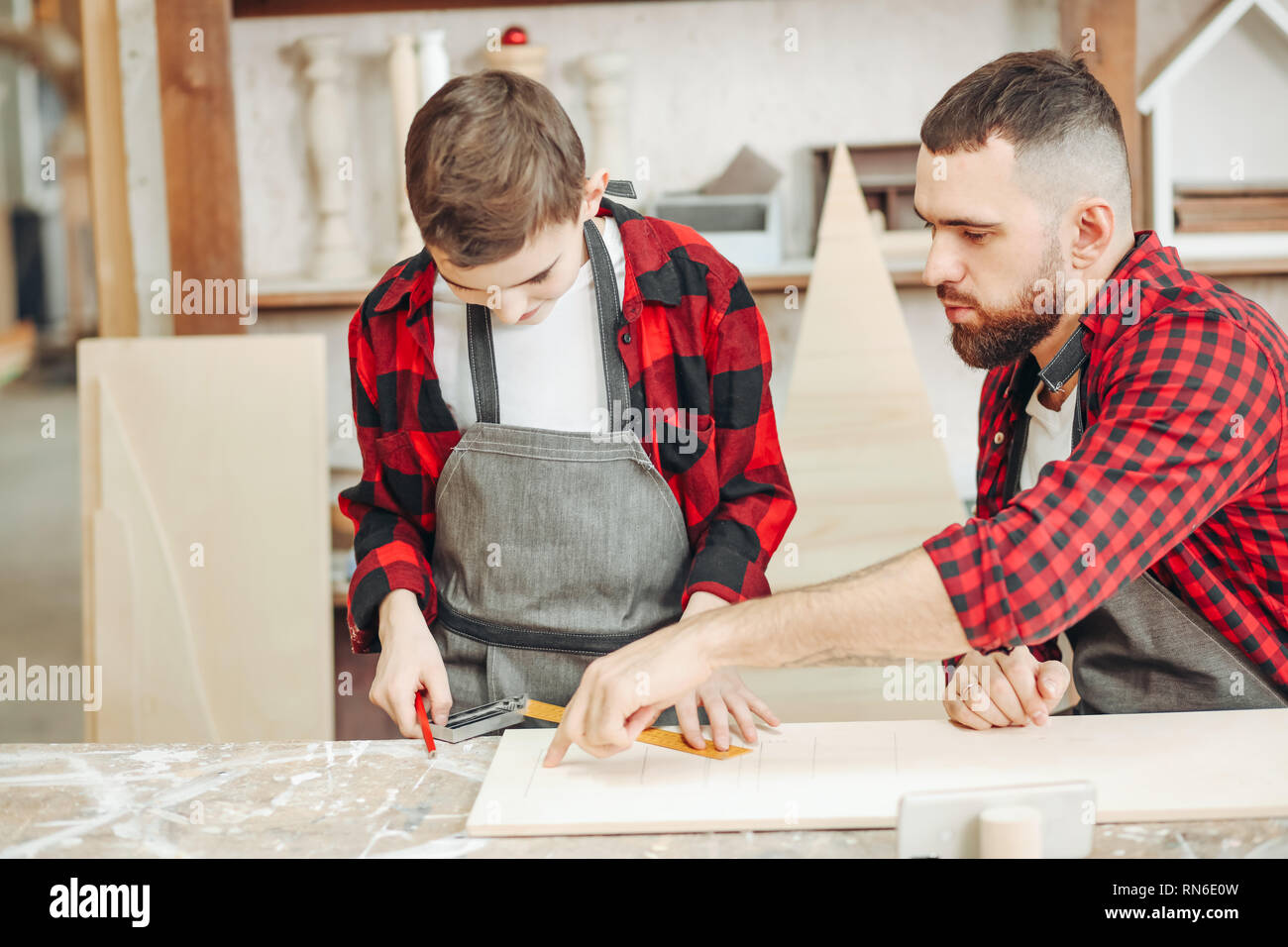 Hardworking caucasian junior school age boy holding ruler and making ...