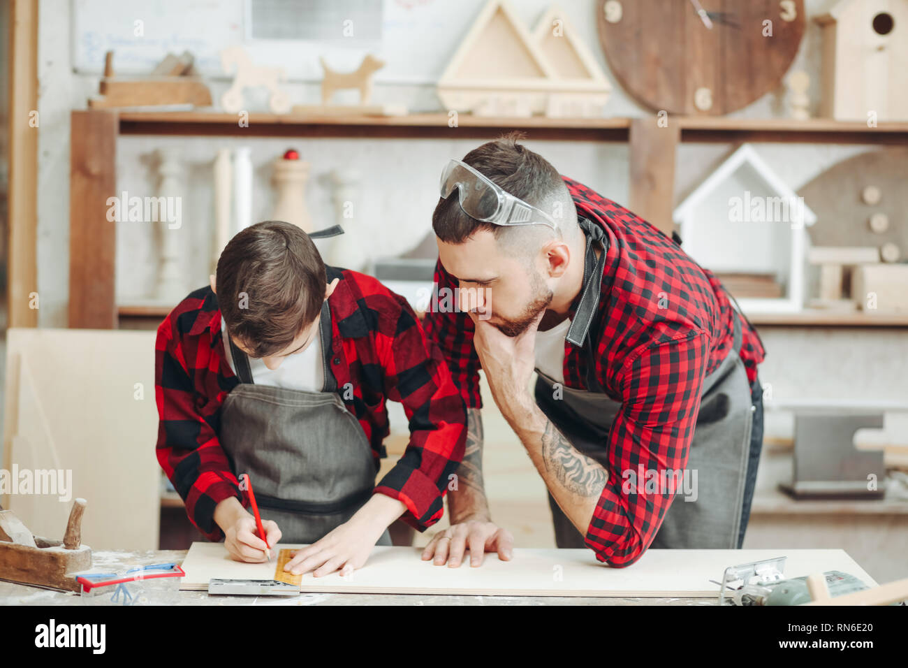 profession, carpentry, woodwork and family concept - carpentery ...