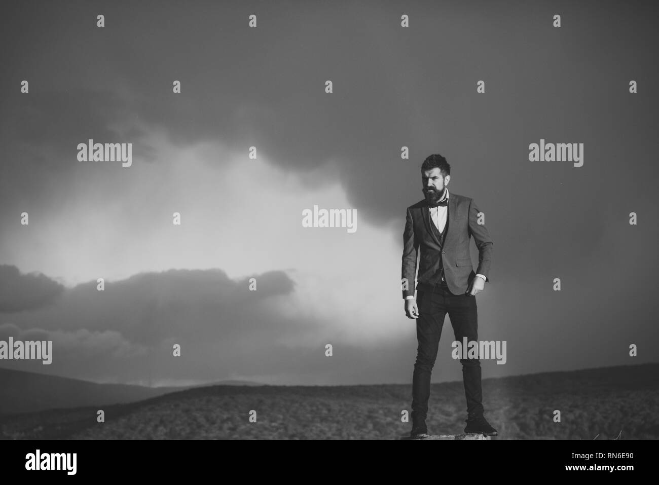 Guy with strict face in suit enjoy scenery and loneliness Stock Photo ...