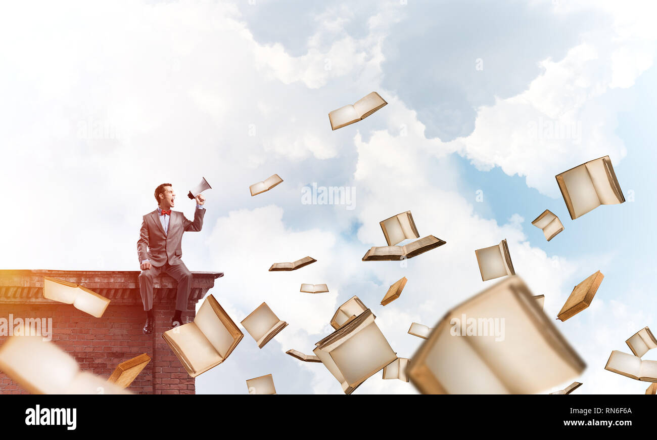 Holding on to edge of building hi-res stock photography and images - Alamy