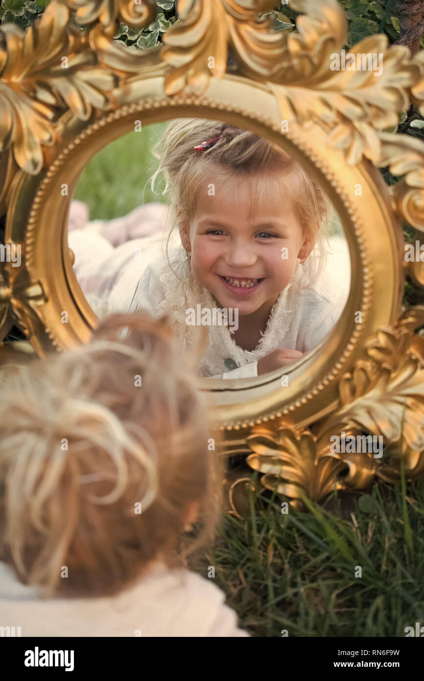 Child smile in mirror on natural landscape Stock Photo - Alamy