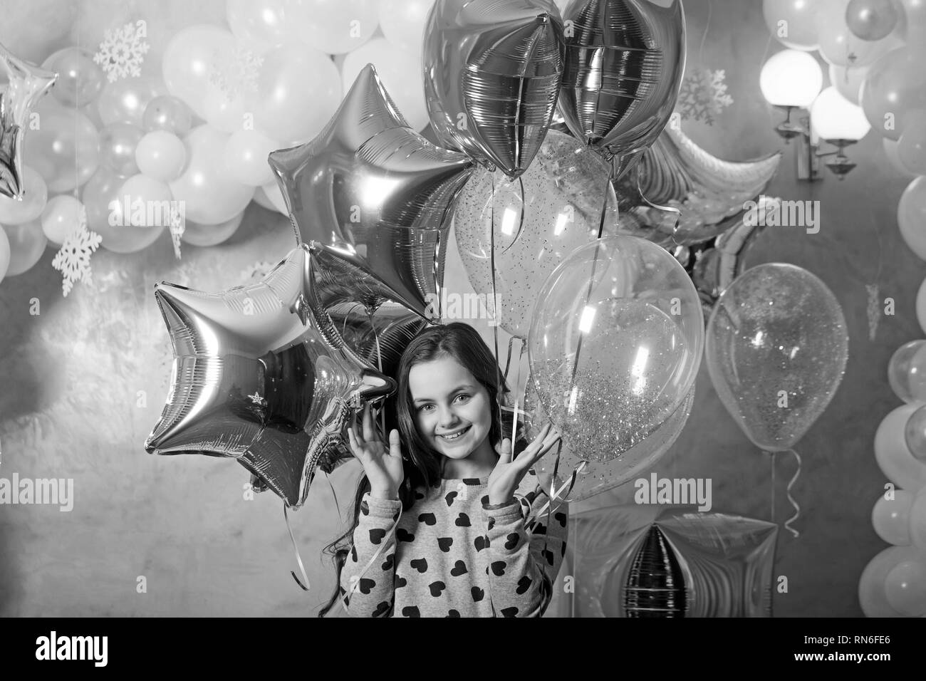 Little girl smile with golden silver star balloons, christmas. Happy ...