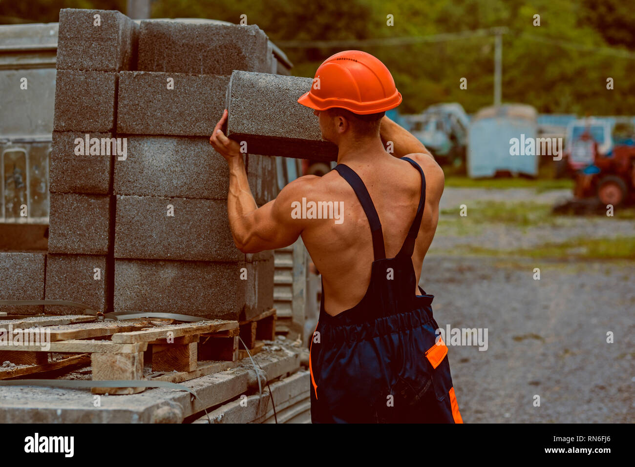 Construction worker. Construction worker carry bricks. Construction ...
