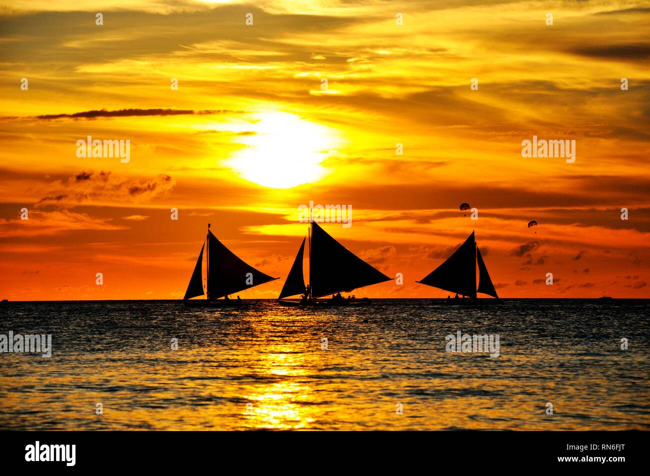 Three boats sailing on horizon hi-res stock photography and images - Alamy