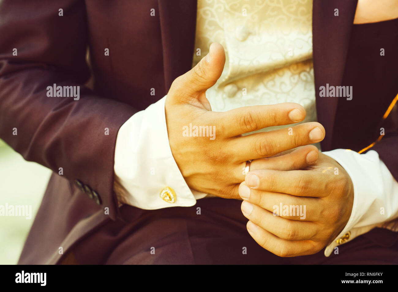 Male groom hands with ring Stock Photo - Alamy