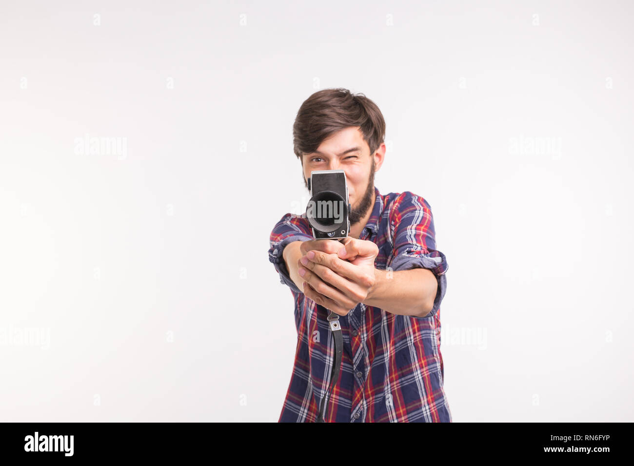 Funny people, photo and vintage concept - young man using vintage ...