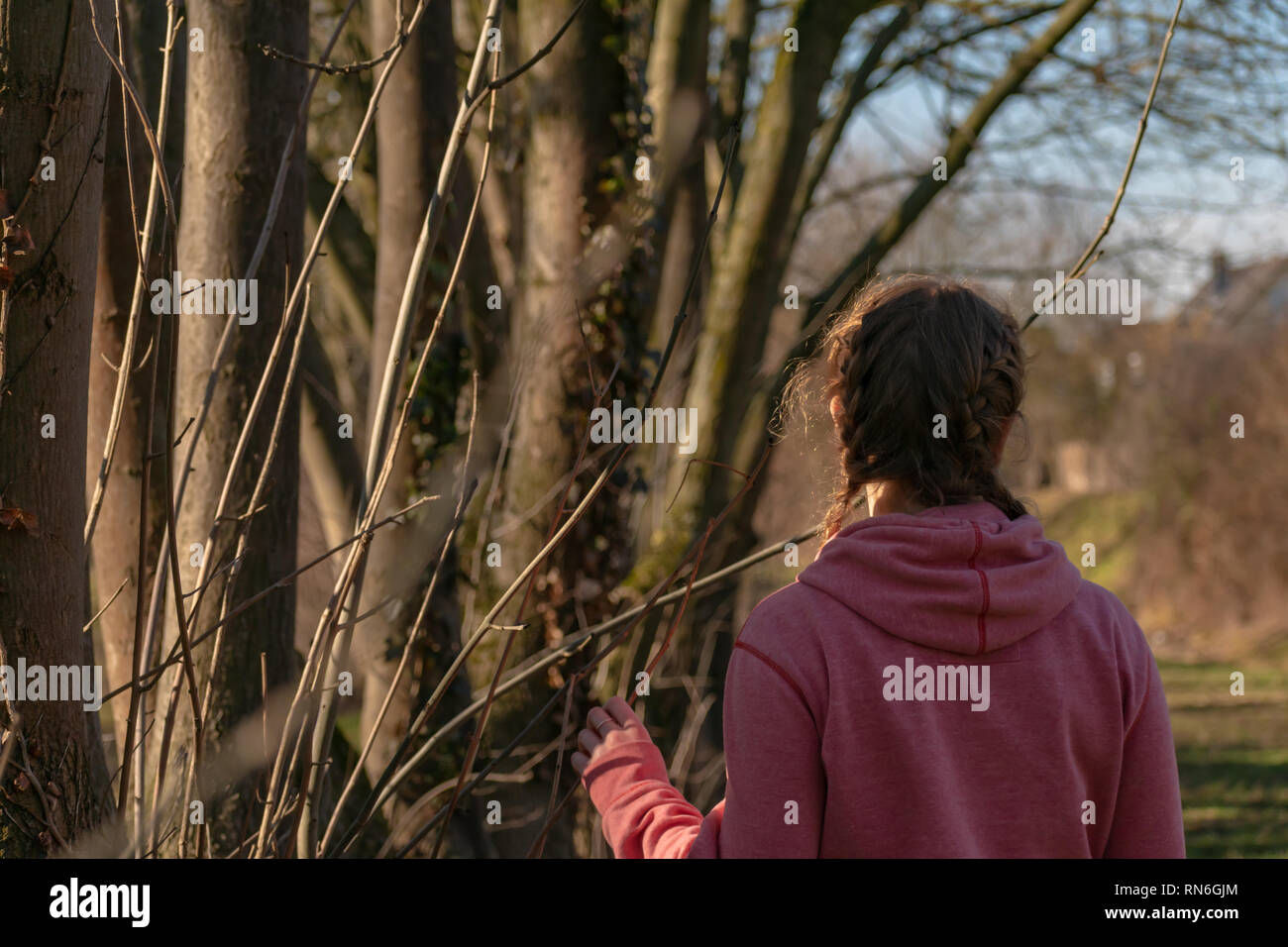 Model looking forward in this soft park in urban Lichtenbroich ...