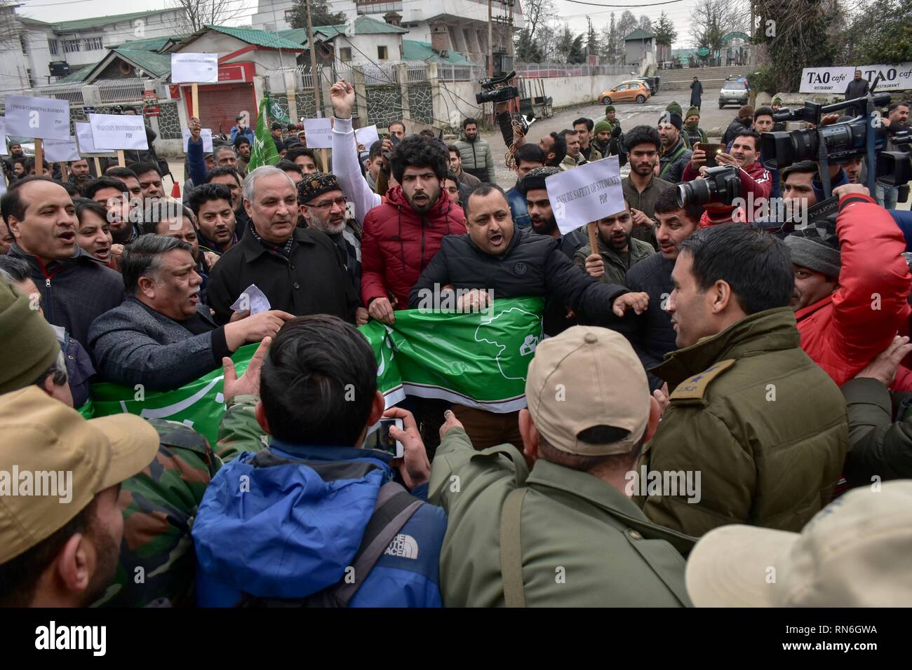 A police officer seen stopping the members of the Peoples Democratic ...