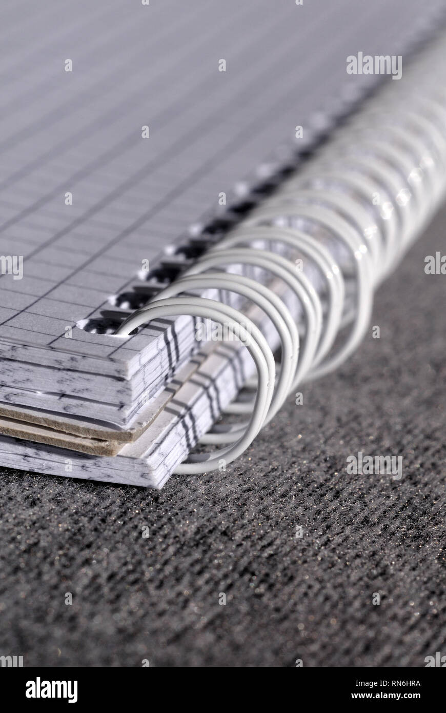 Open notepad with spring-bound binding closeup. Shallow depth of field ...