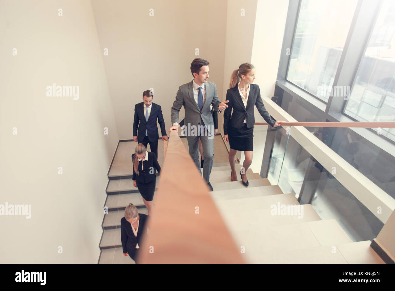 Business people walking up stairs hi-res stock photography and images ...