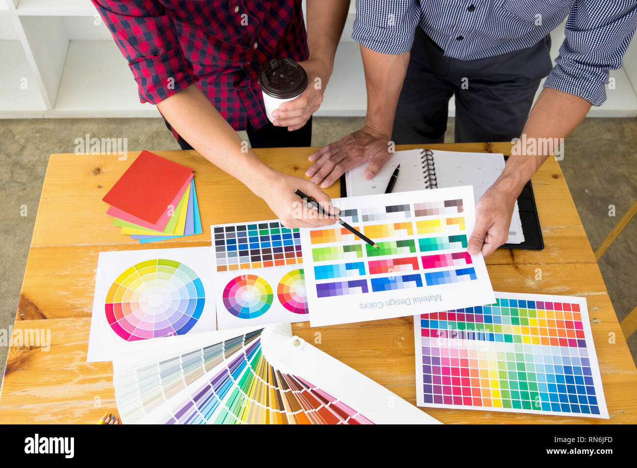 Graphic designers choose colors from the color bands samples for design ...
