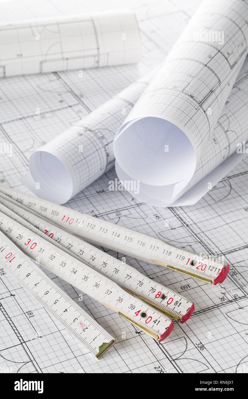 Rolls of architectural blueprint house building plans with folding rule ...