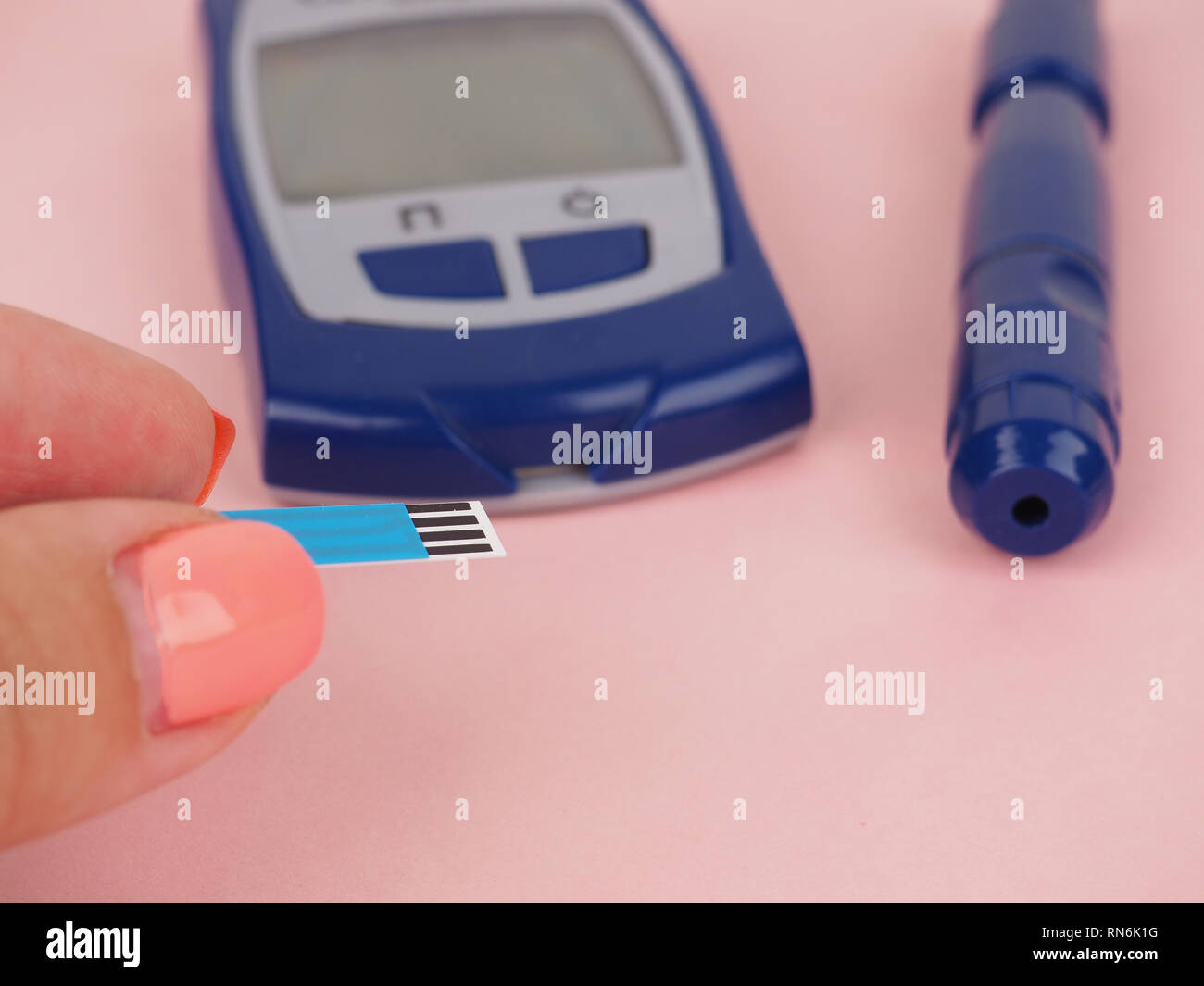 diabetes pen injection needle, syringes lie on pink background ...
