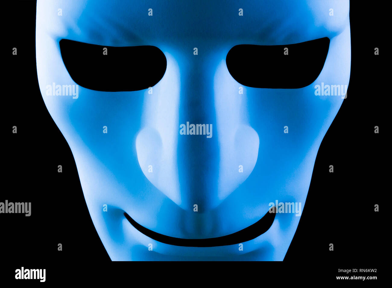 Blue face mask artificial intelligence concept close up on a black ...