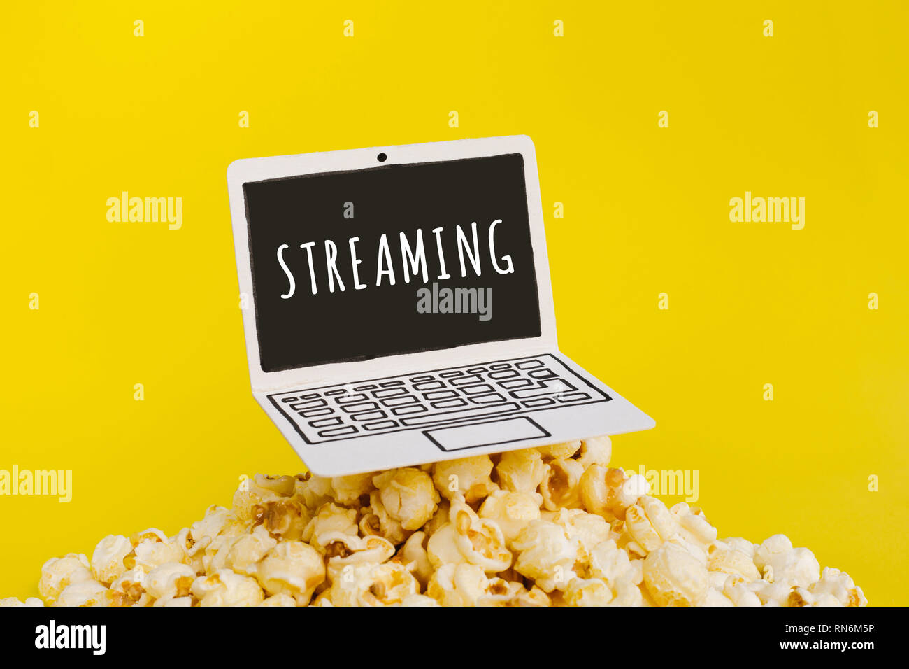 live streaming concepts with text on paper art laptop and pop corn on ...