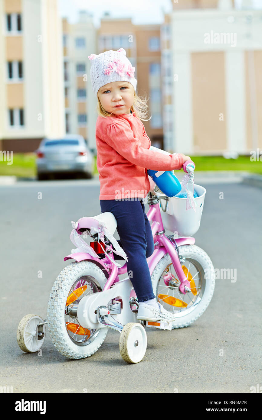 little girl riding a bicycle. child outdoor Stock Photo - Alamy